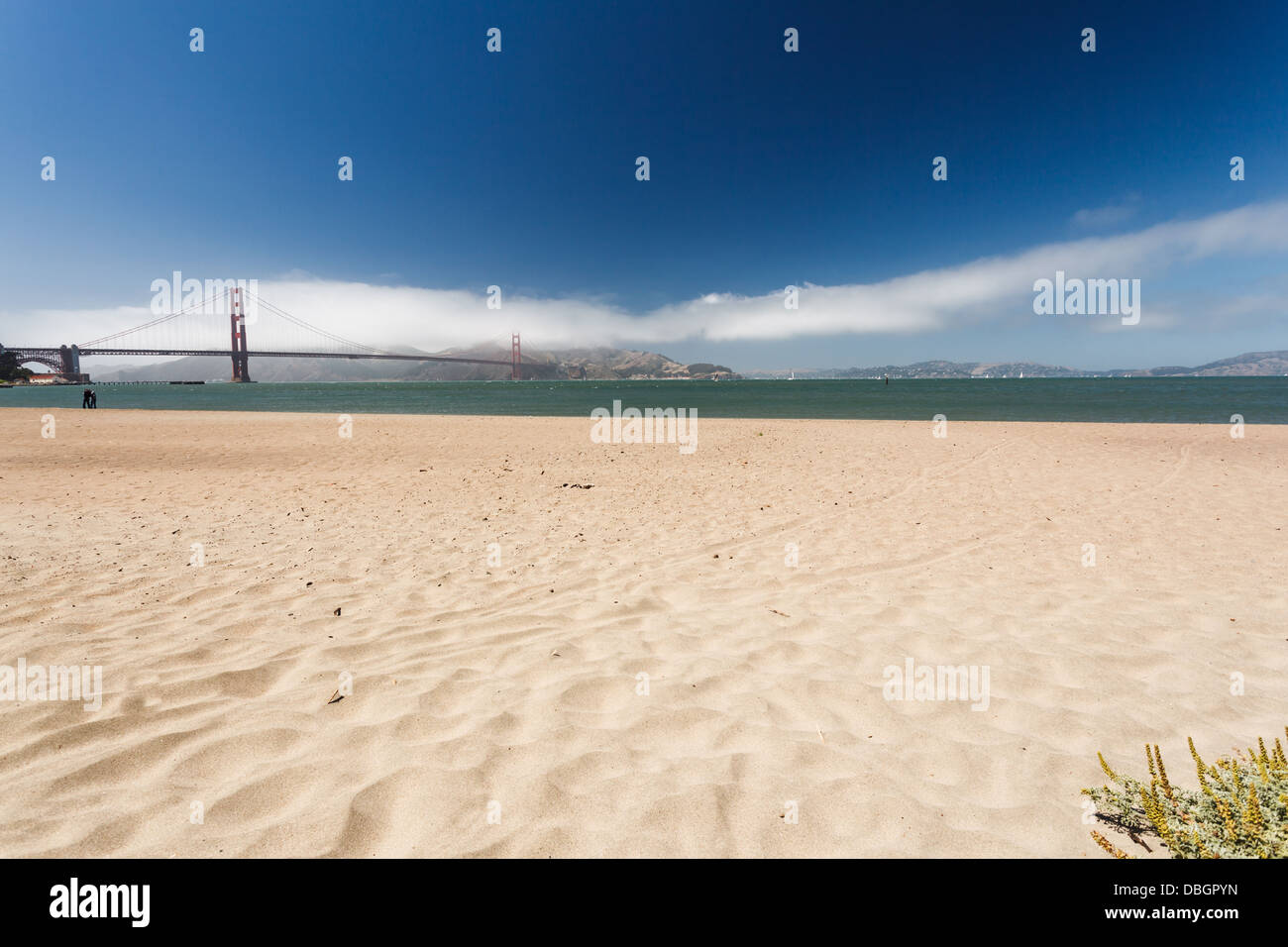 San Francisco beach with distant view of Golden Gate Bridge Stock Photo ...