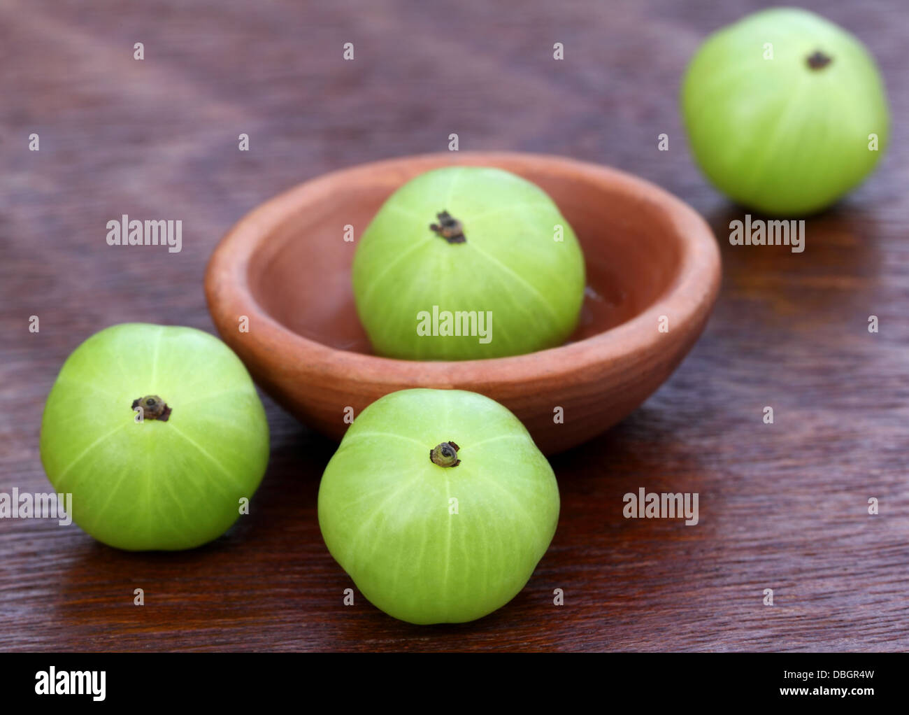 Fresh amla with a small bowl Stock Photo - Alamy