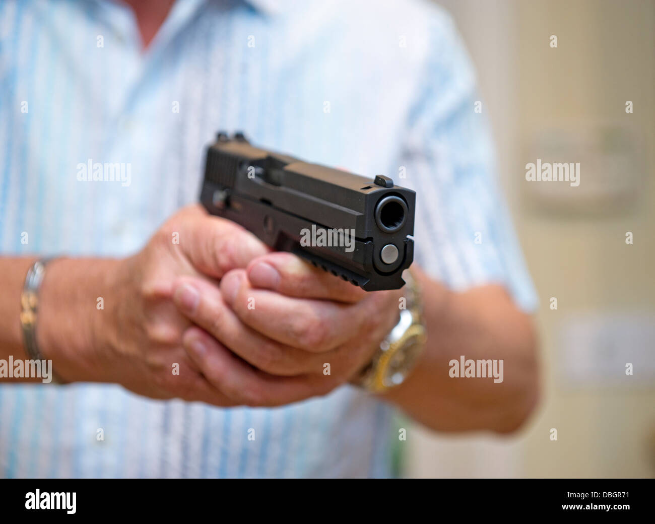 A Sig Sauer P250 gun being kept as a protection against intruders at a ...