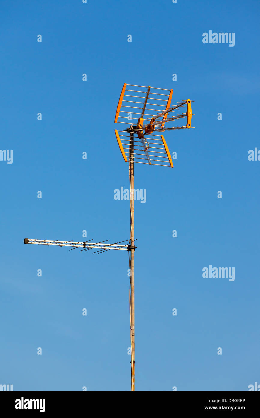 Television aerial against a blue sky, closeup Stock Photo - Alamy