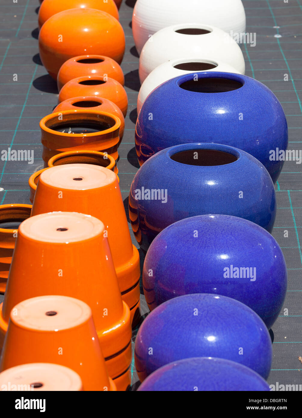 Colorful ceramic pots in market, sunny day Stock Photo - Alamy