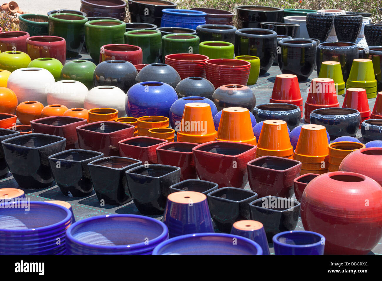 Colorful ceramic pots in market, sunny day Stock Photo - Alamy
