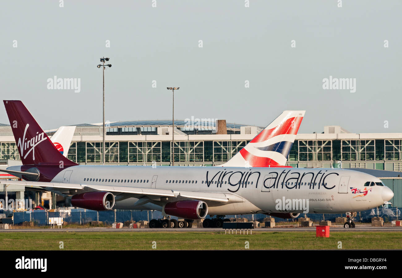 A Virgin Atlantic Airbus A340 (A340-313X; G-VAIR) and British Airways ...