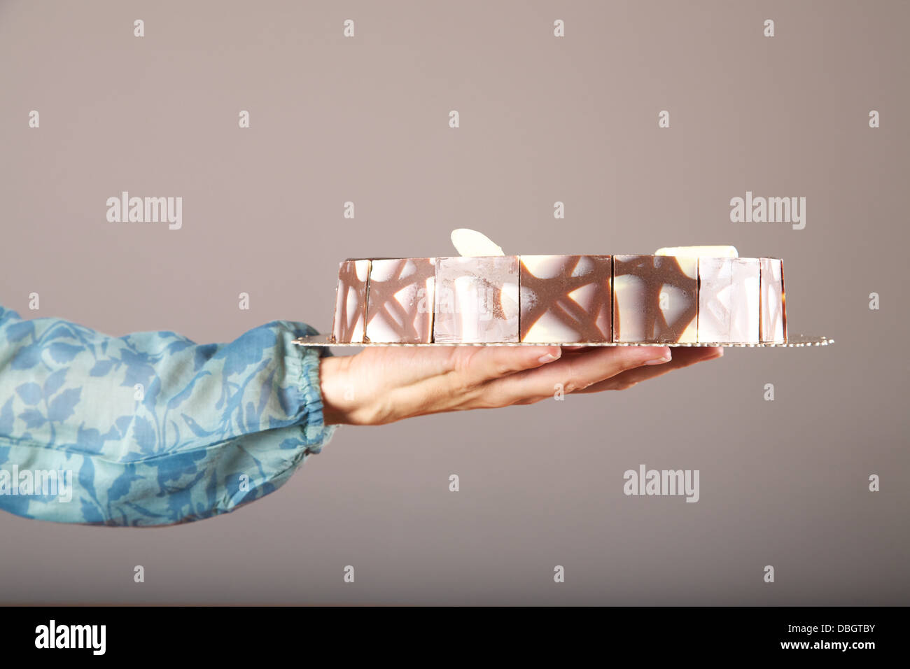 hand with cake Stock Photo - Alamy