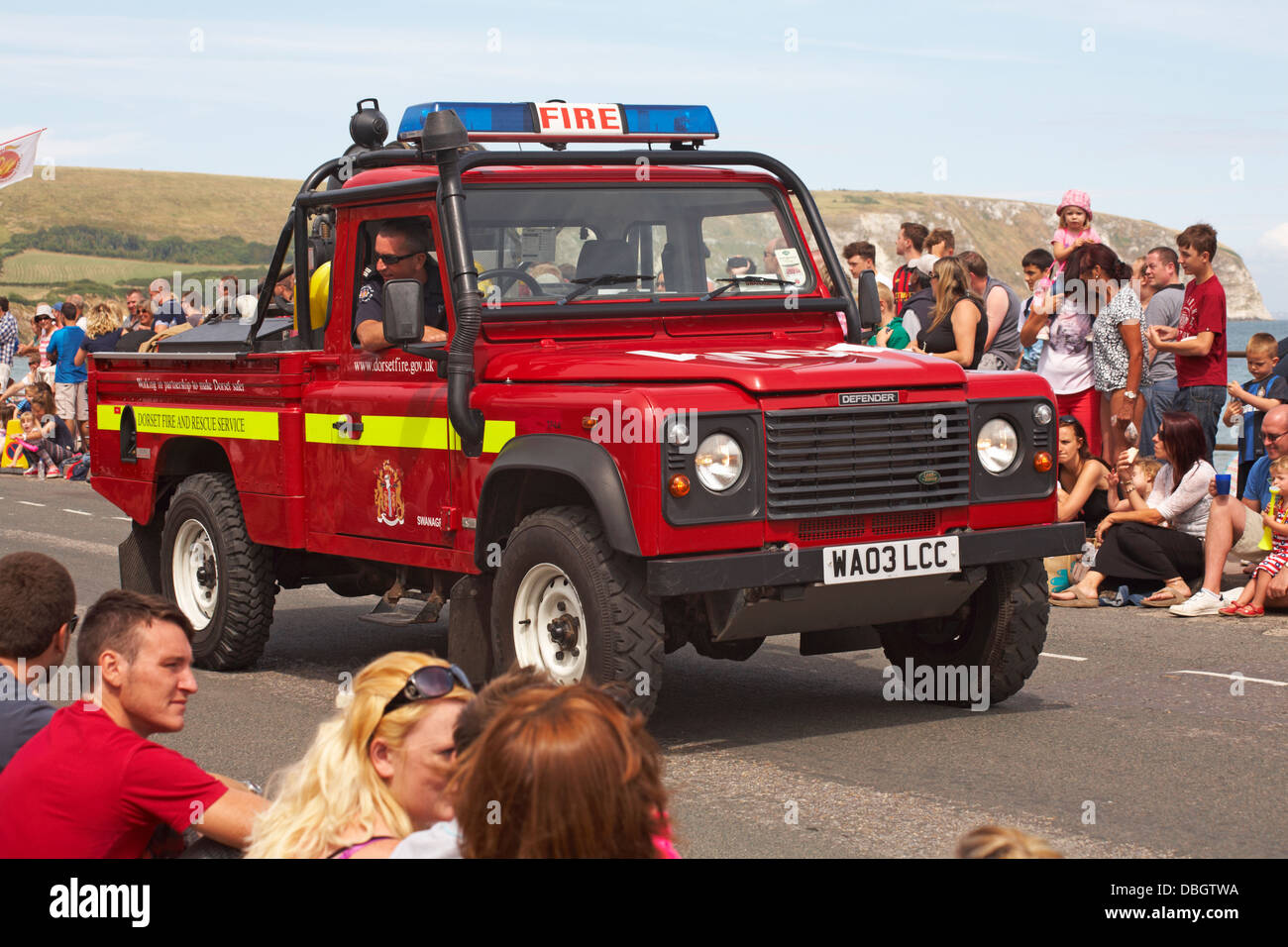 fireman driving Fire Defender Land Rover taking part in Swanage ...