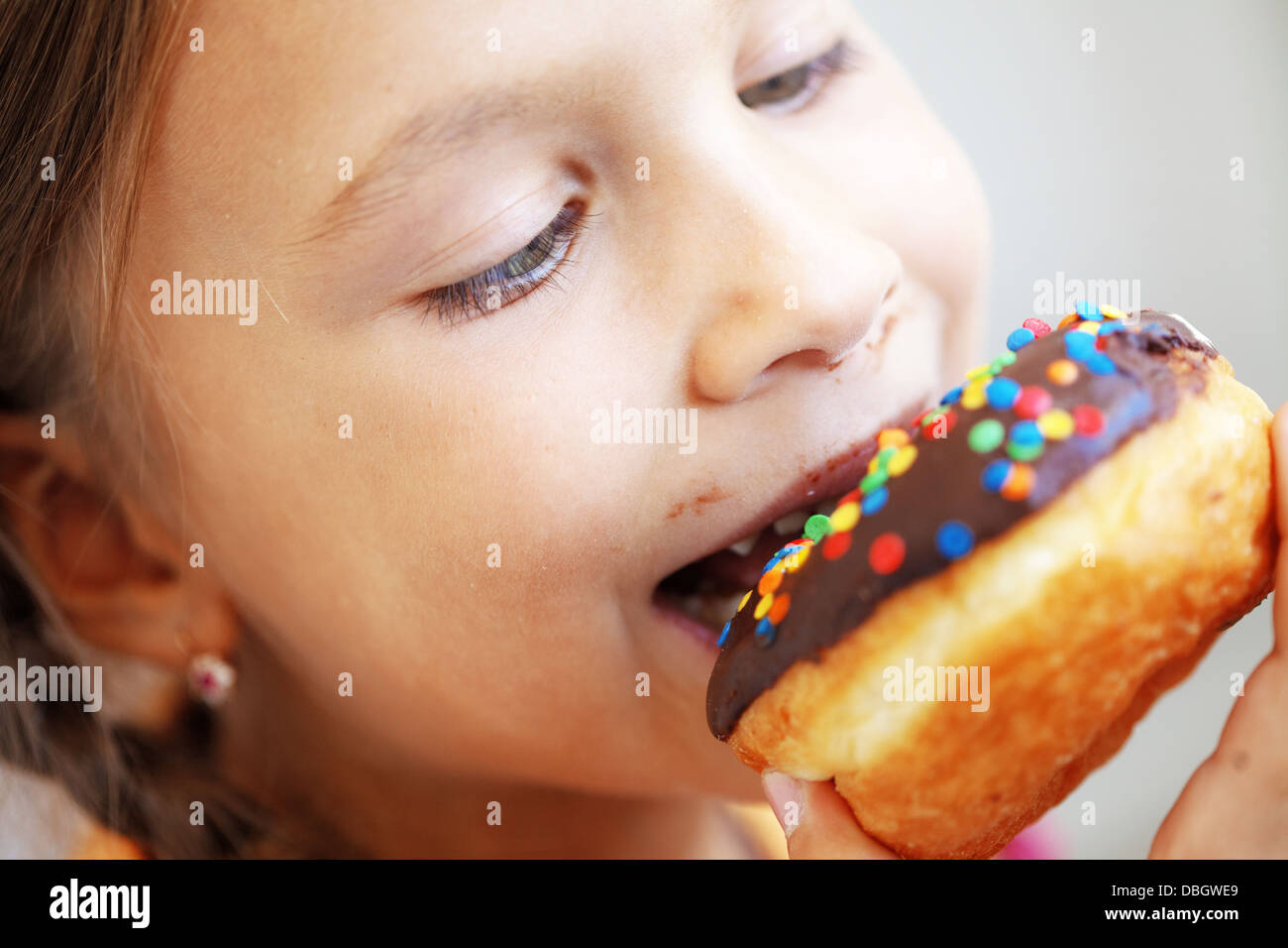 Child eating doughnut fat hi-res stock photography and images - Alamy