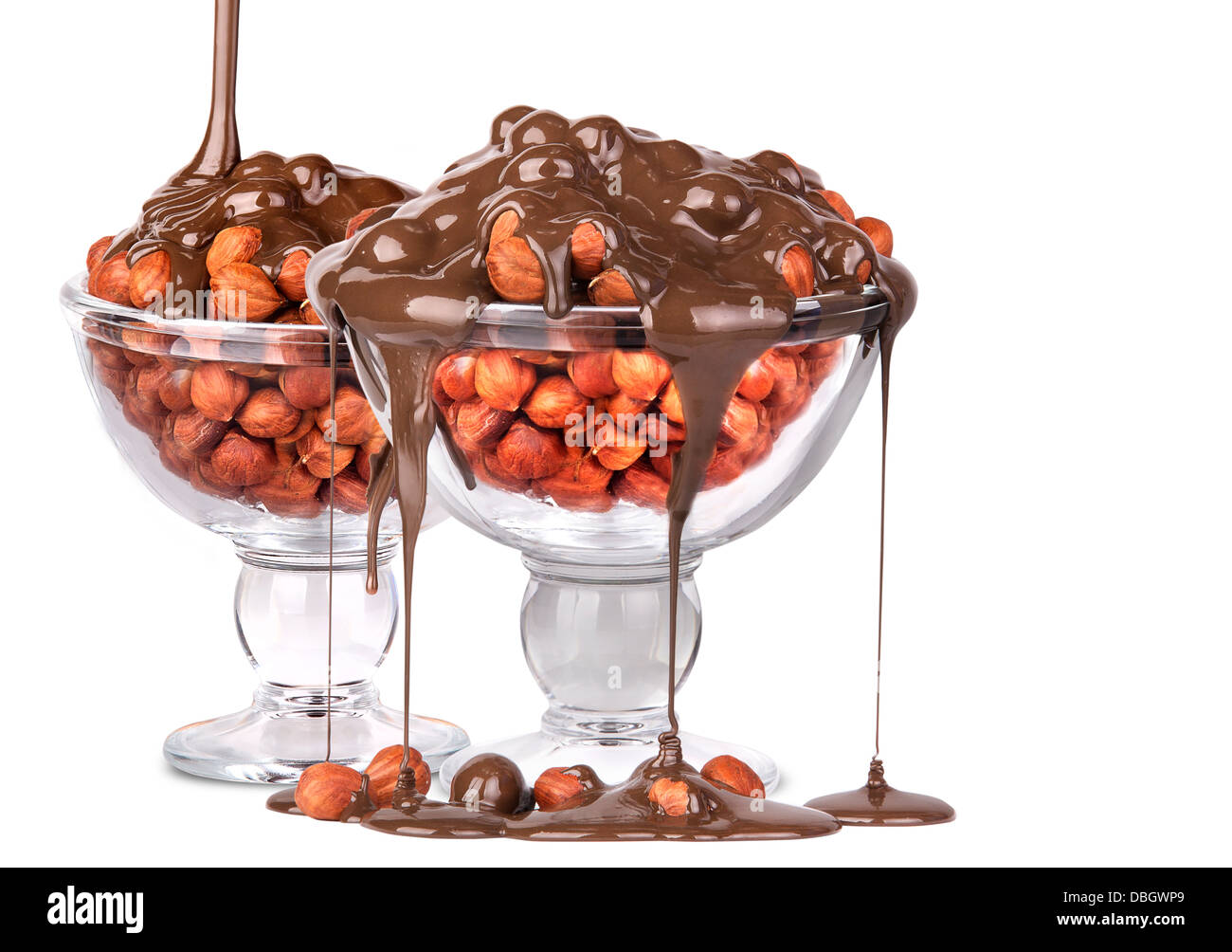 Chocolate Flowing over nuts in a glass Isolated on White - Tasty look ...