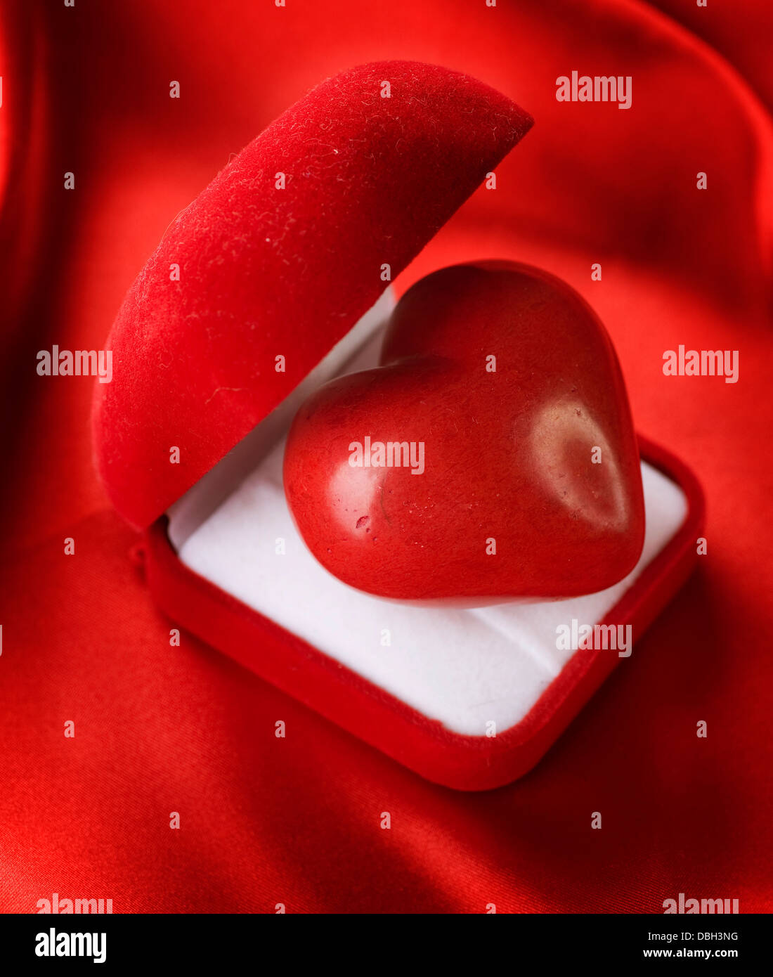 Valentine concept. Red velvet Gift Box with a heart Stock Photo - Alamy