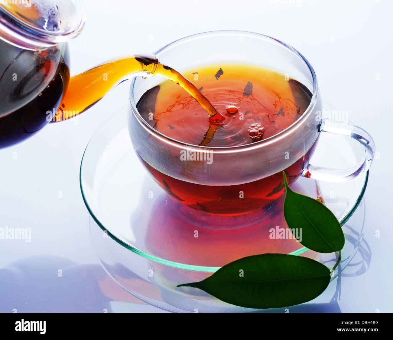 Pouring Healthy Tea Over White Stock Photo - Alamy