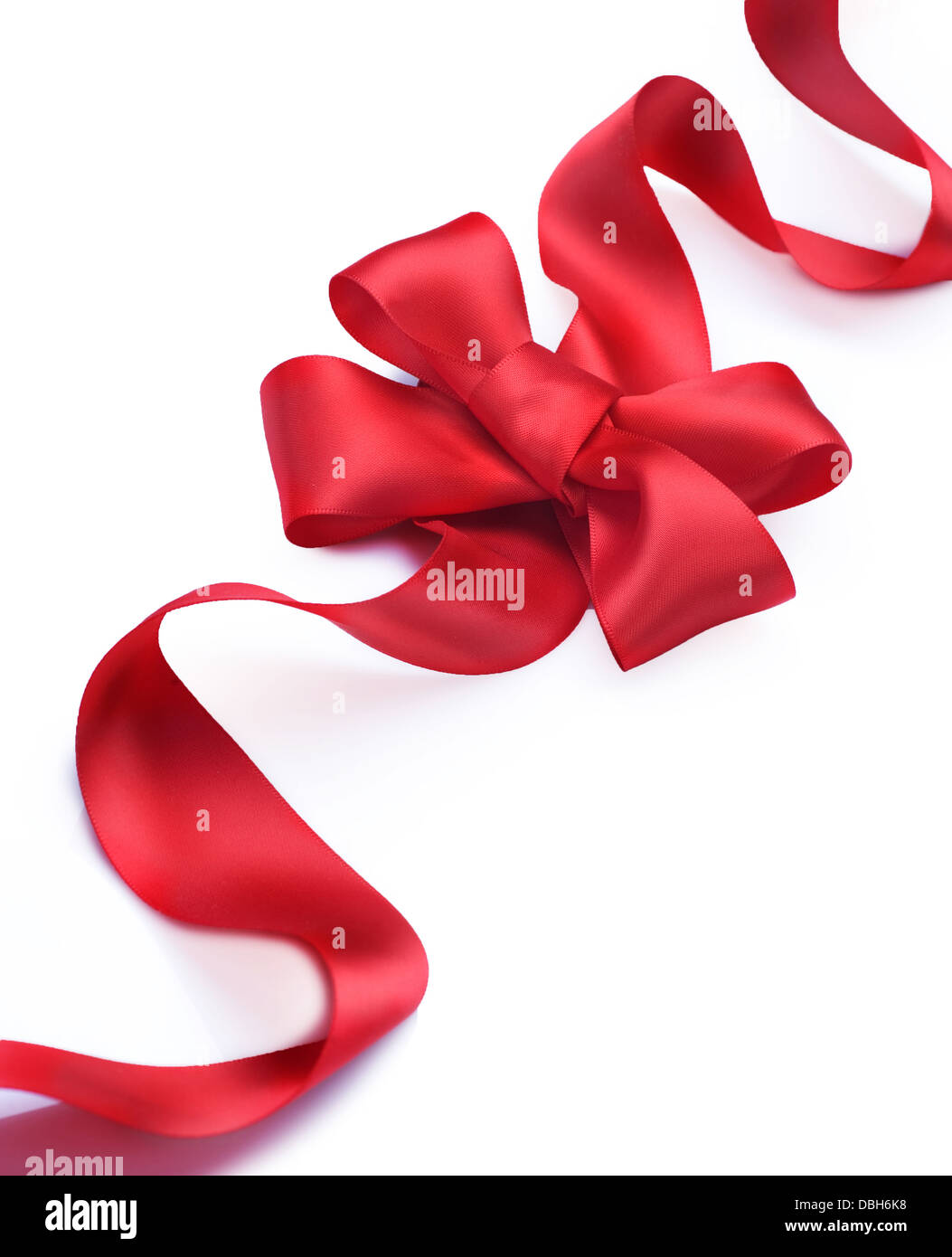 Red satin gift bow. Ribbon. Isolated on white Stock Photo - Alamy