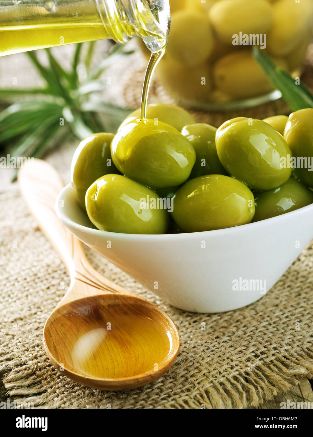 Olives And Pouring Olive Oil Stock Photo - Alamy
