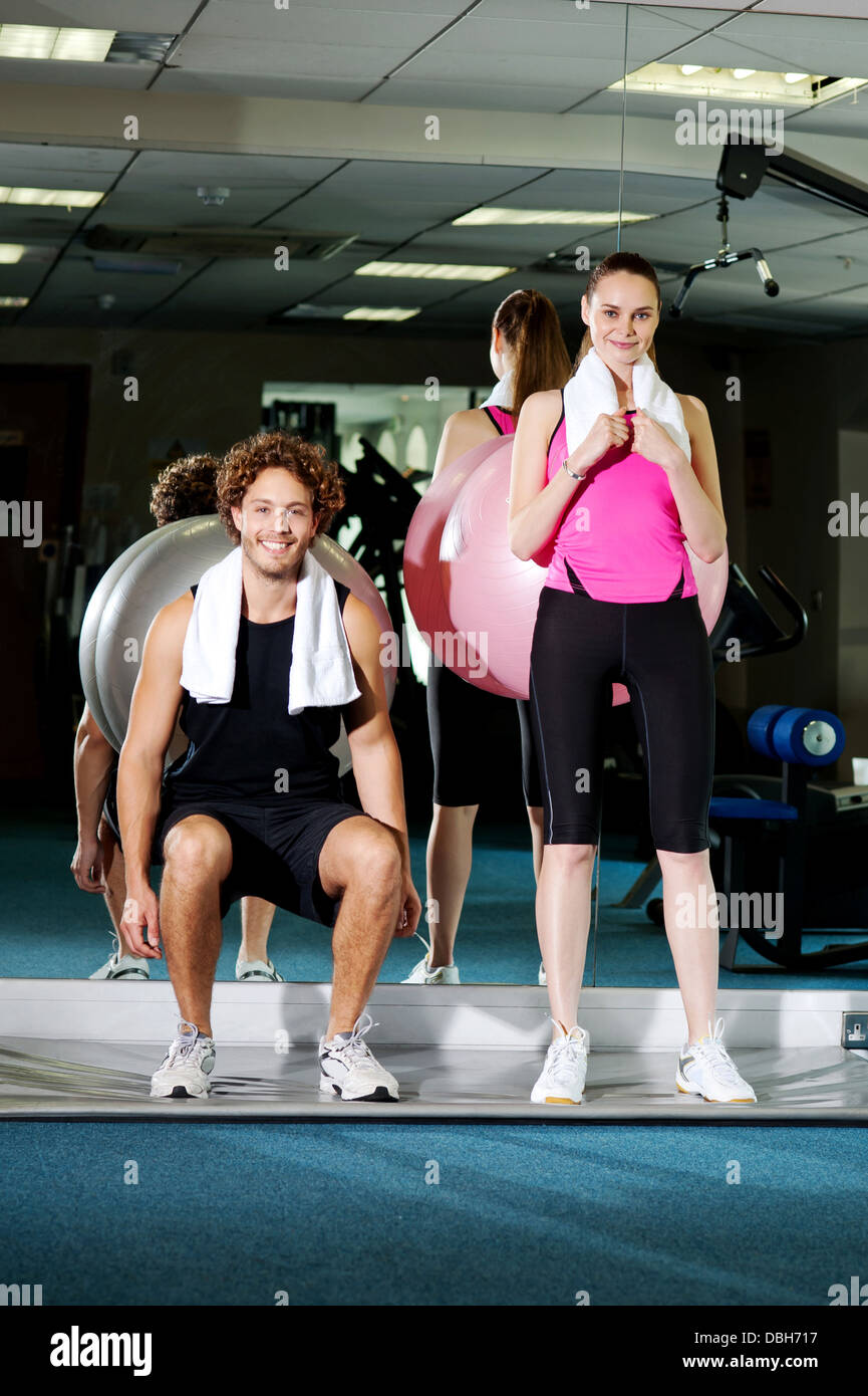 Gym friends working out with the exercise ball Stock Photo - Alamy