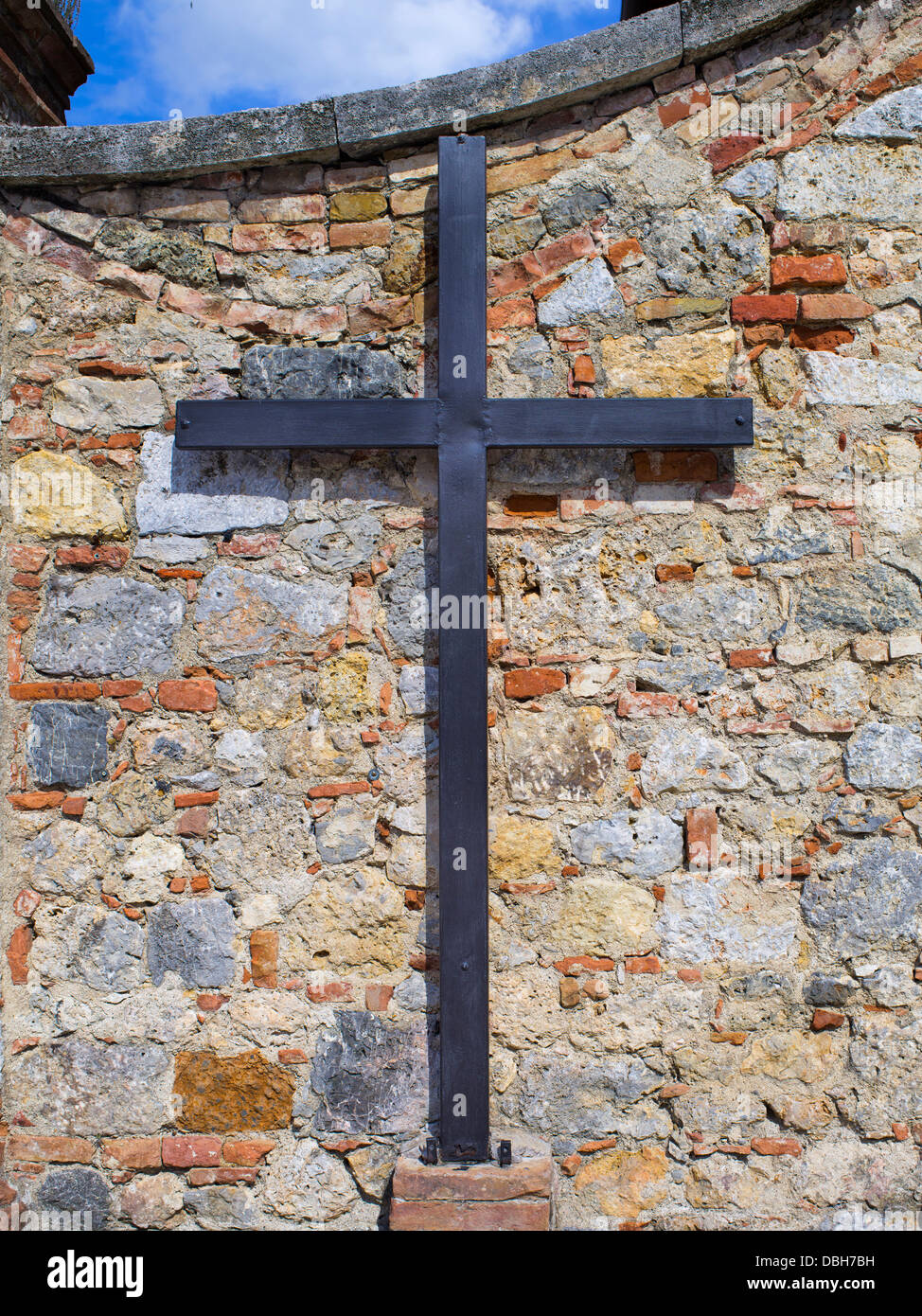 cross in an old tuscan wall wall Stock Photo - Alamy