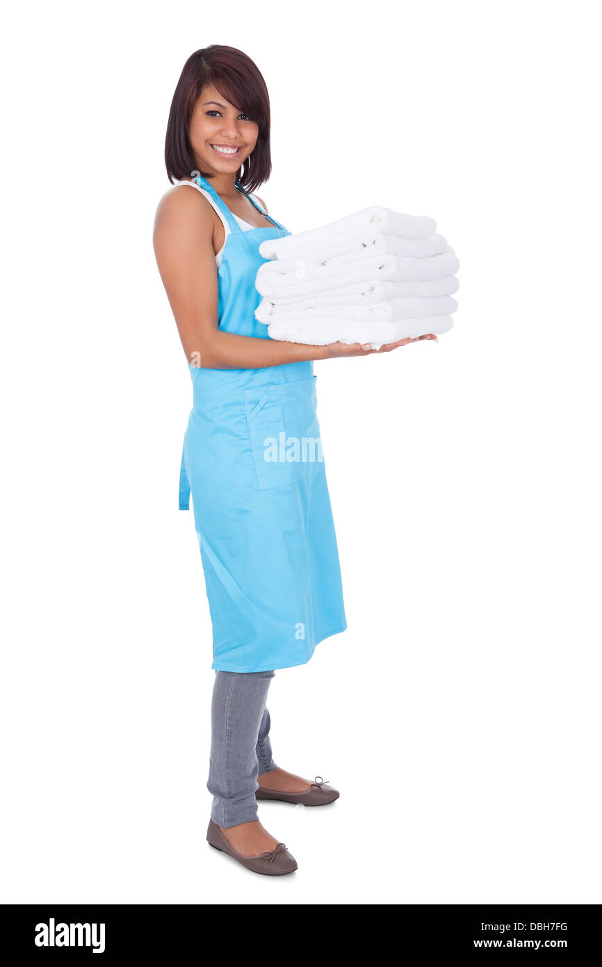 Smiling maid woman with towels Stock Photo - Alamy