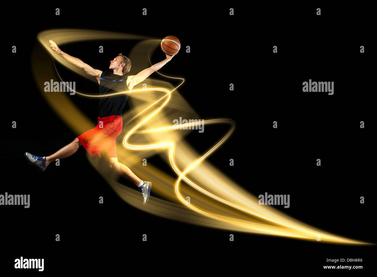 Basketball player with a ball Stock Photo - Alamy