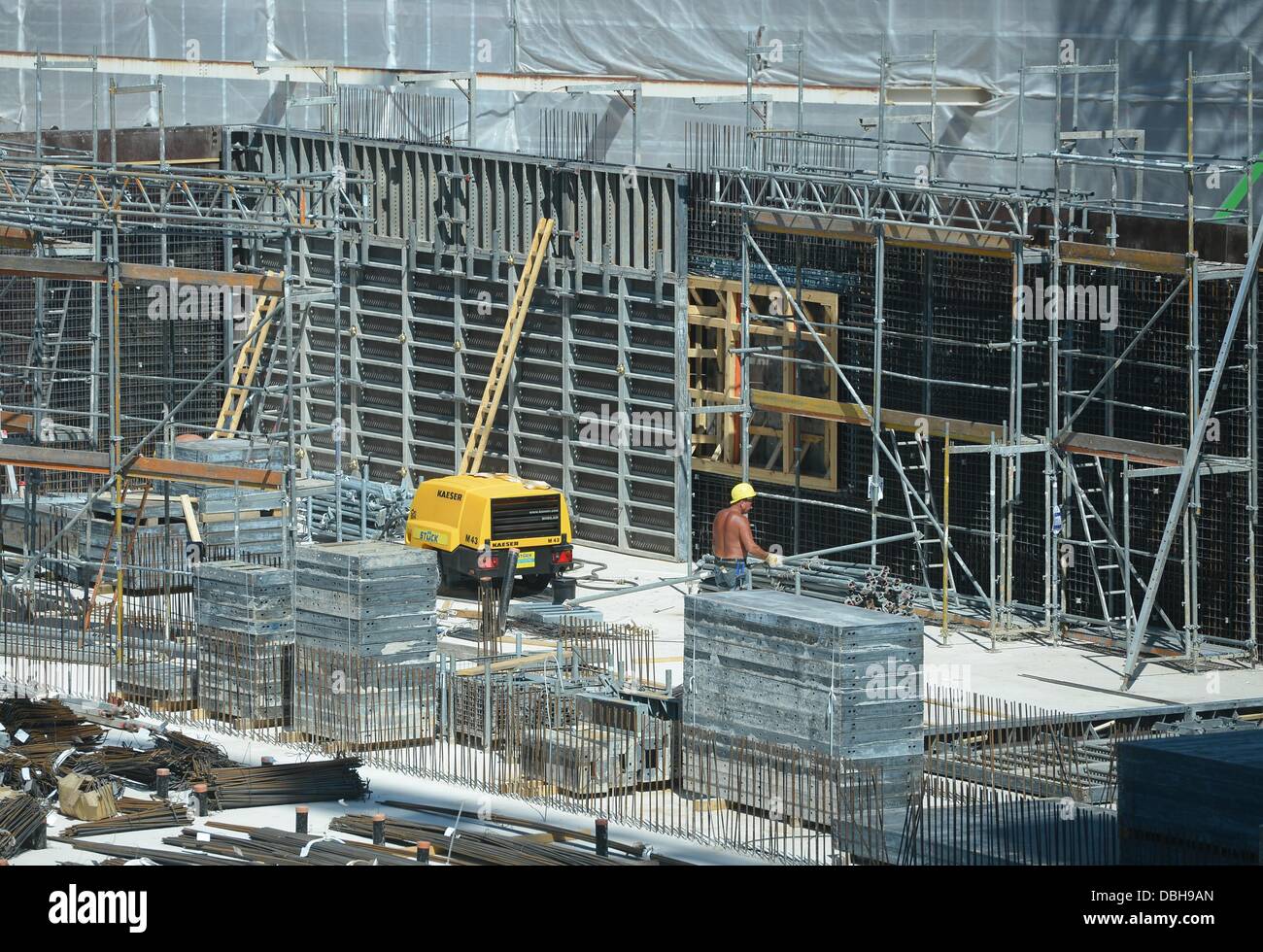 A construction worker works on a construction site in Hamburg, Germany ...