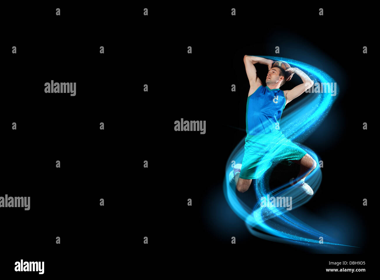 Basketball player with a ball Stock Photo - Alamy