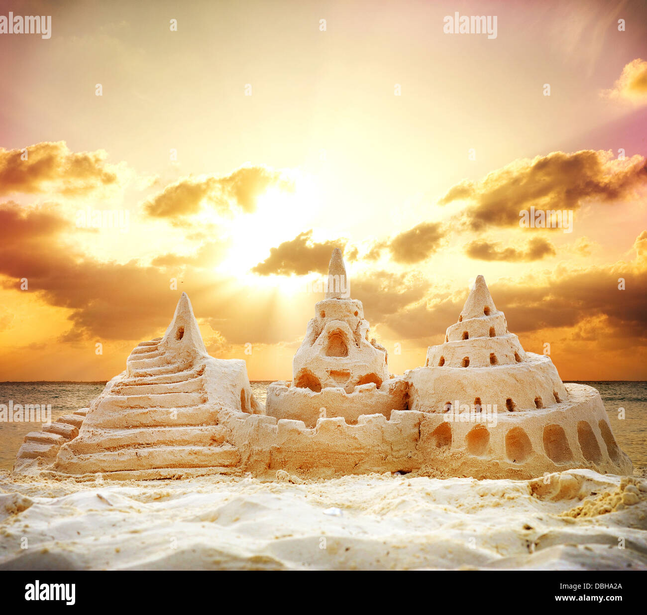 Sand Castle over Sunset on the Beach Stock Photo - Alamy