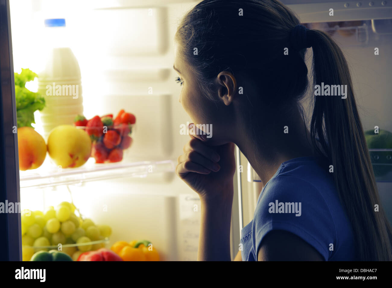 Young woman choosing food Stock Photo - Alamy