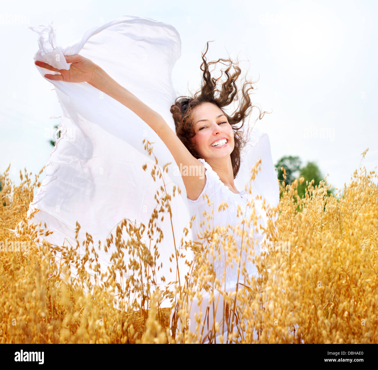 Beautiful Happy Girl on the Wheat Field Stock Photo - Alamy