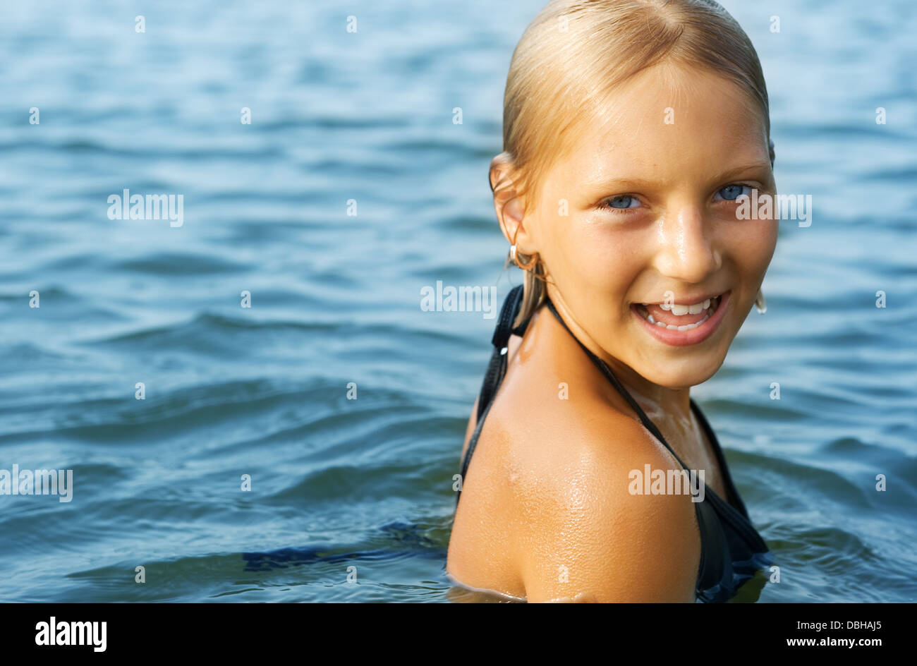 Happy Cute Little Girl Swimming In Water Stock Photo - Alamy