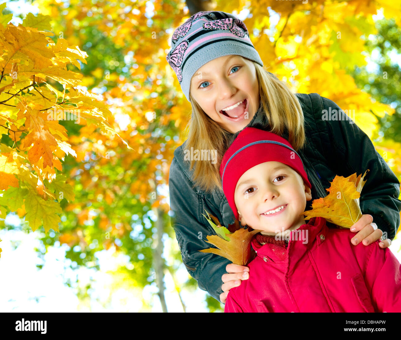 Happy Kids in Autumn Park Stock Photo - Alamy