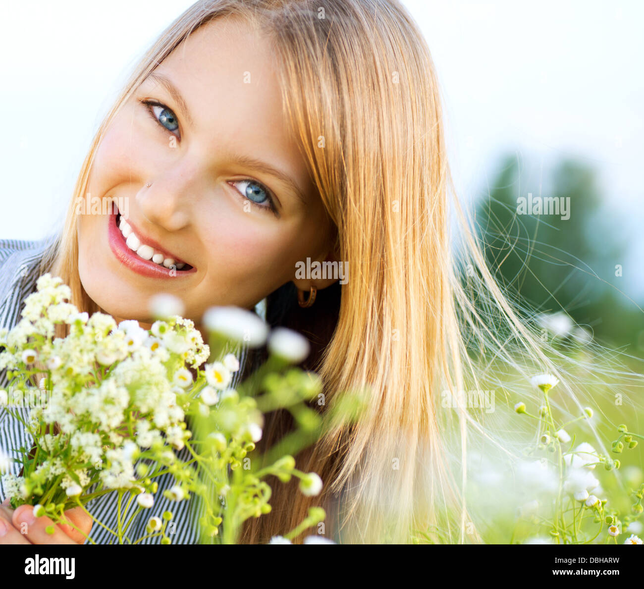 Beautiful Girl Relaxing outdoors. Happy and Smiling Stock Photo - Alamy