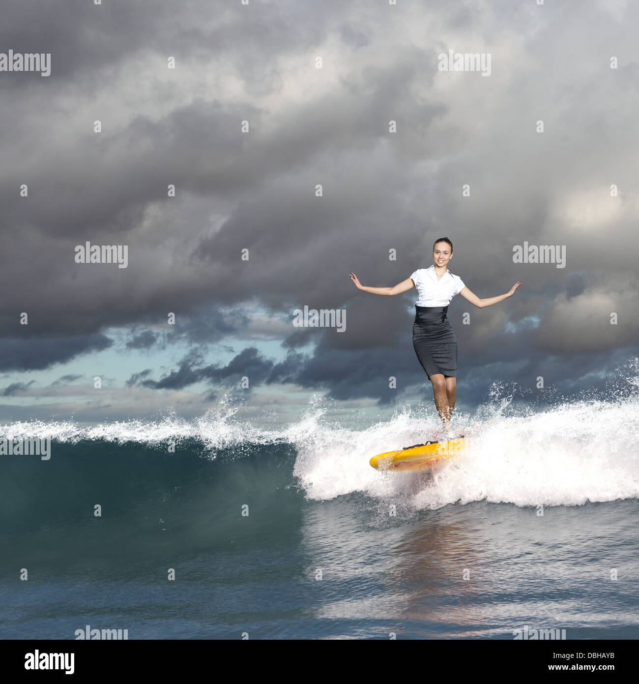Young business person surfing on the waves Stock Photo - Alamy
