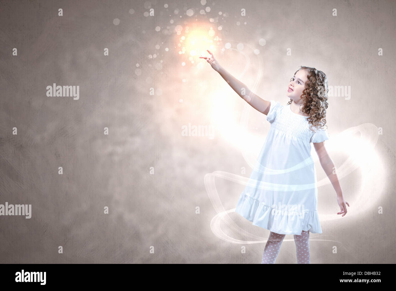 Child with magic light Stock Photo - Alamy