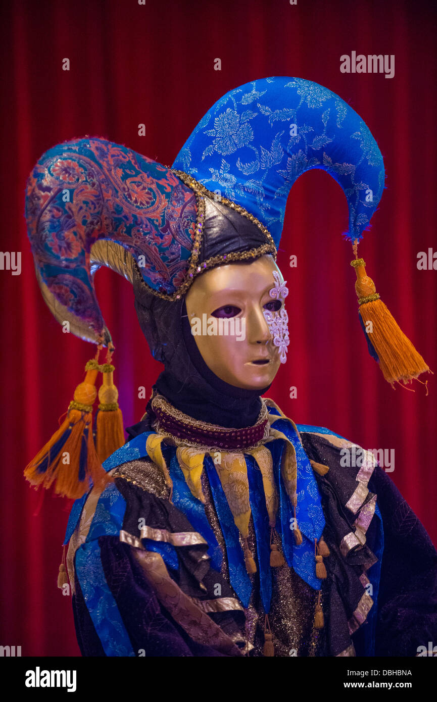 Performer with Venetian style mask at the Carnival experience festival ...