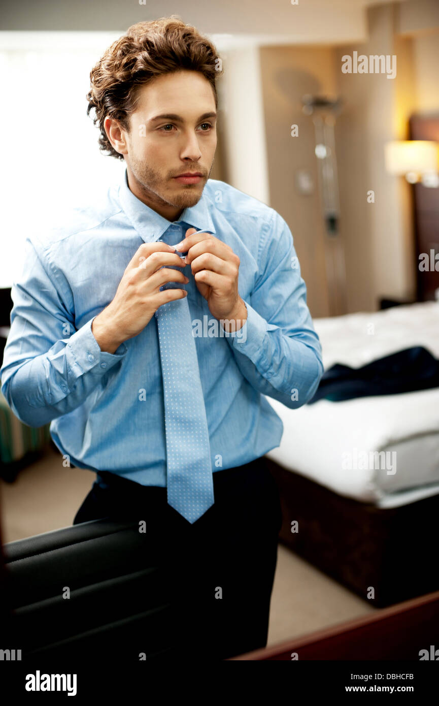 Exhausted executive getting ready for work Stock Photo - Alamy