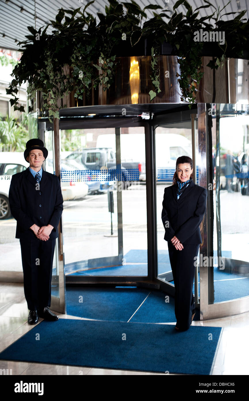 Door man with receptionist at the entrance Stock Photo - Alamy
