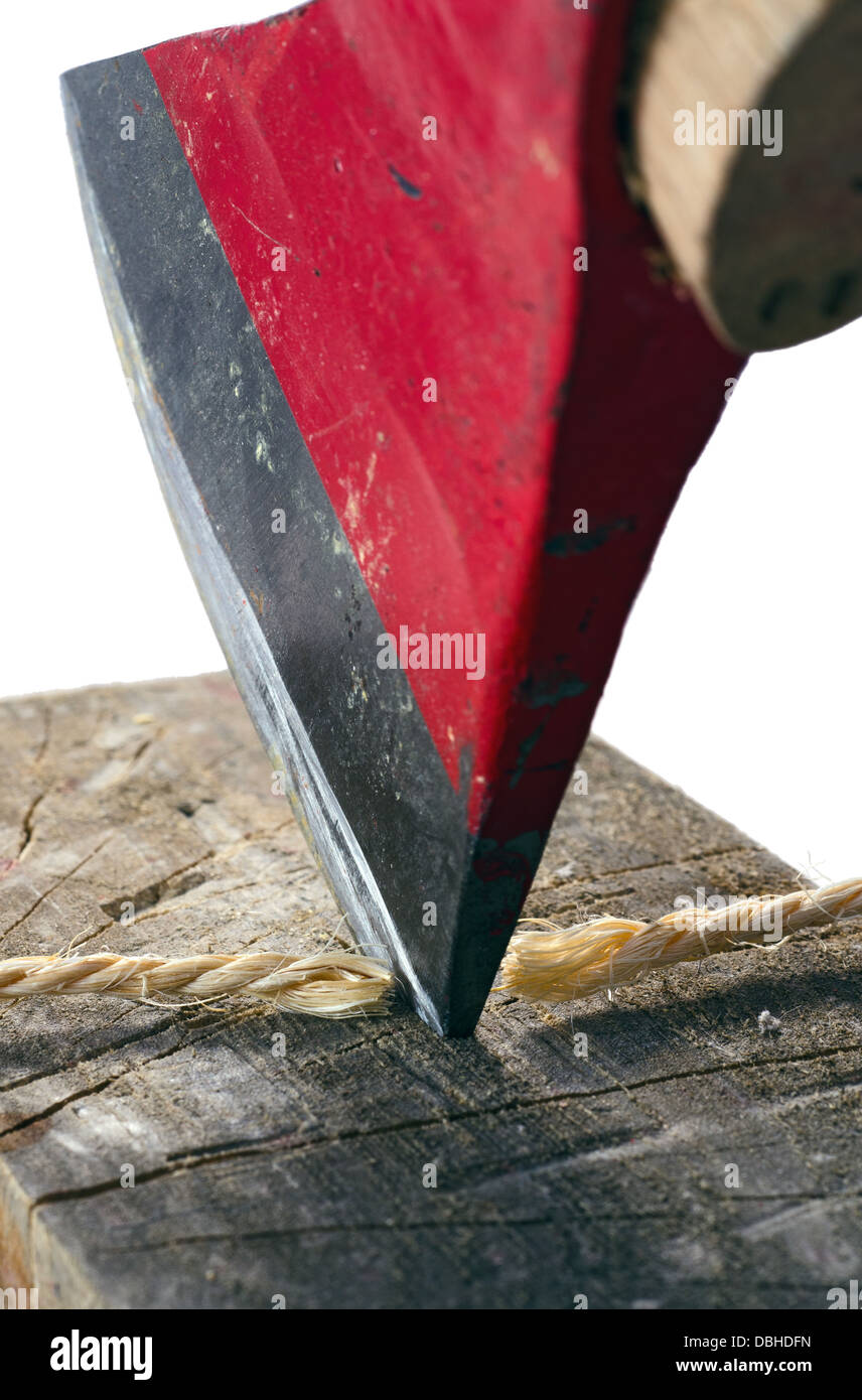 An ax cutting a rope. Isolated on white background Stock Photo - Alamy