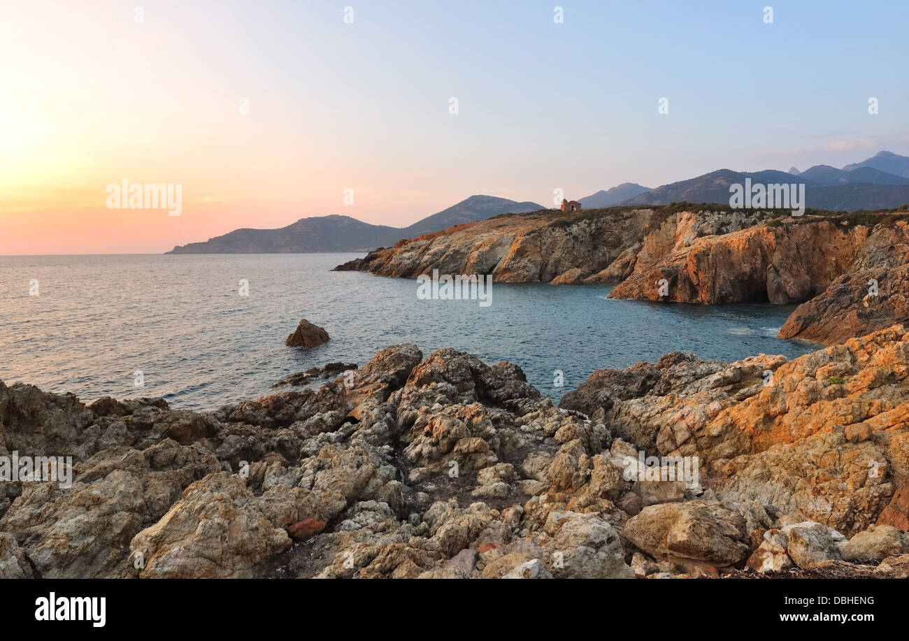beautiful sunset on the orange cliffs of a gulf in Corsica Stock Photo ...