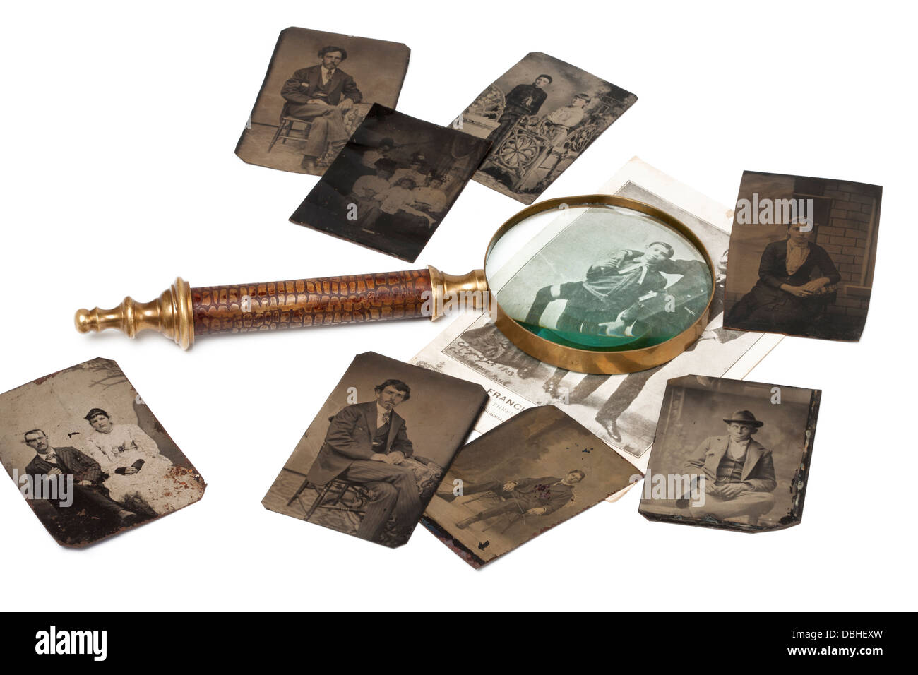 magnifying glass on photos Stock Photo - Alamy