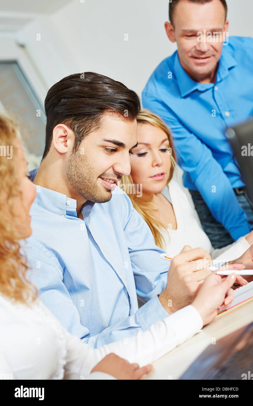 Study group learning in college with a teacher Stock Photo - Alamy