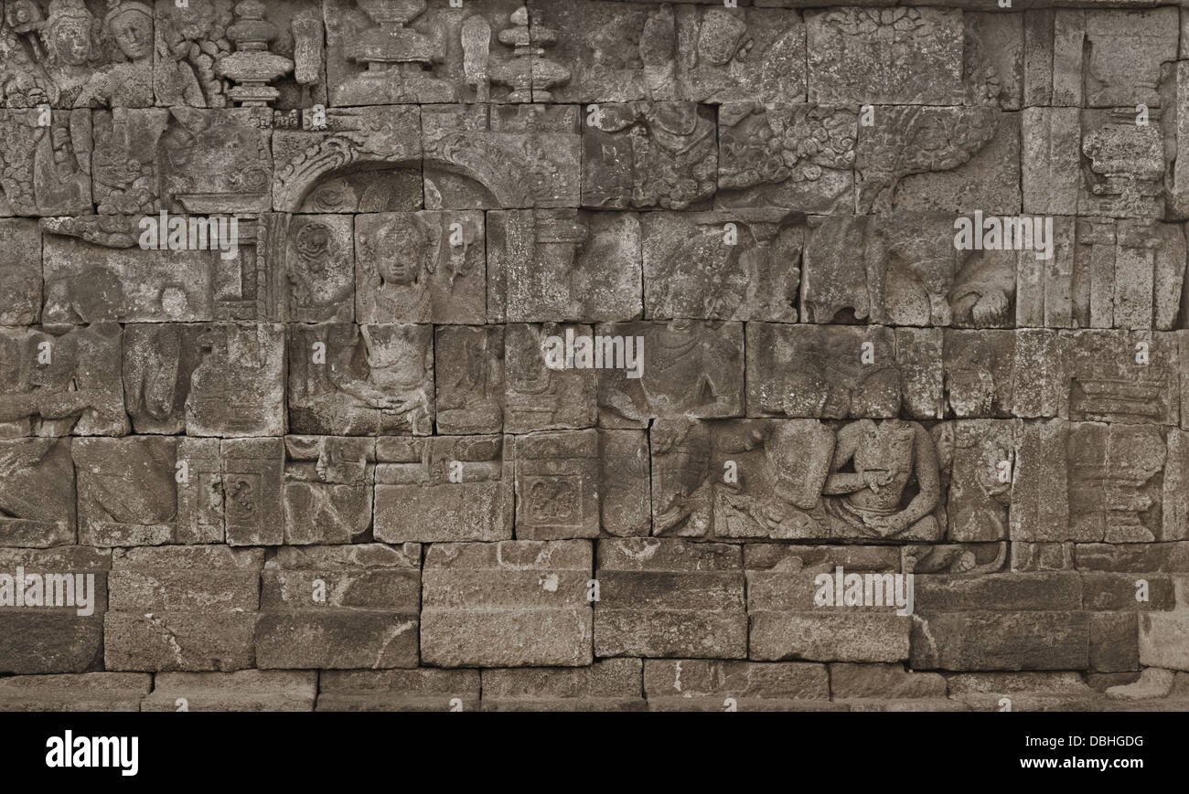 Medieval carving on the walls of the Borobudur temple. Indonesia ...