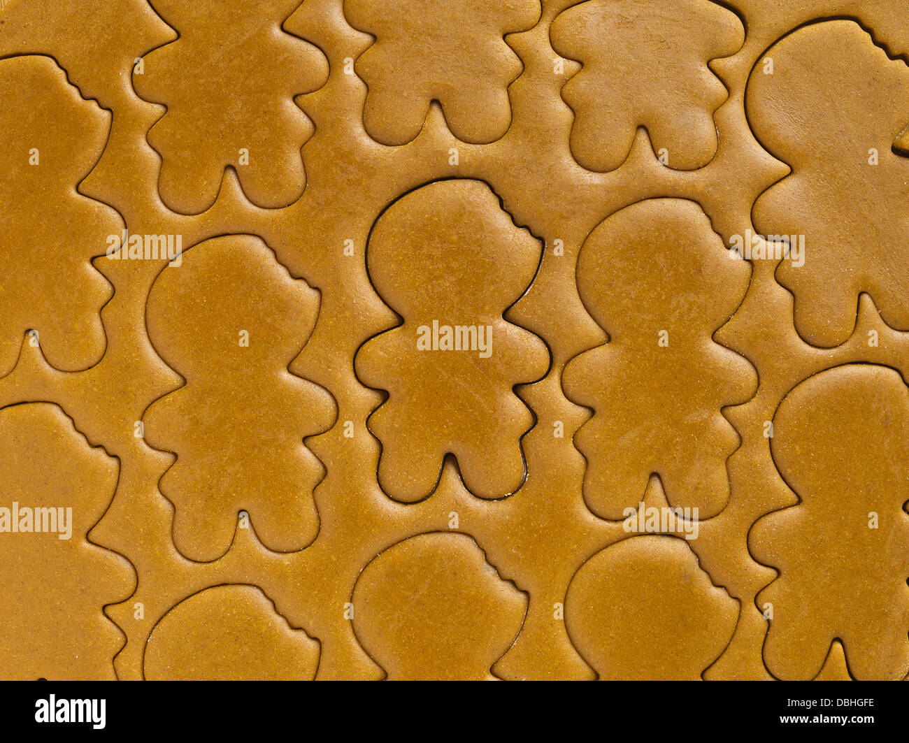 image of gingerbread man shapes on dough Stock Photo - Alamy