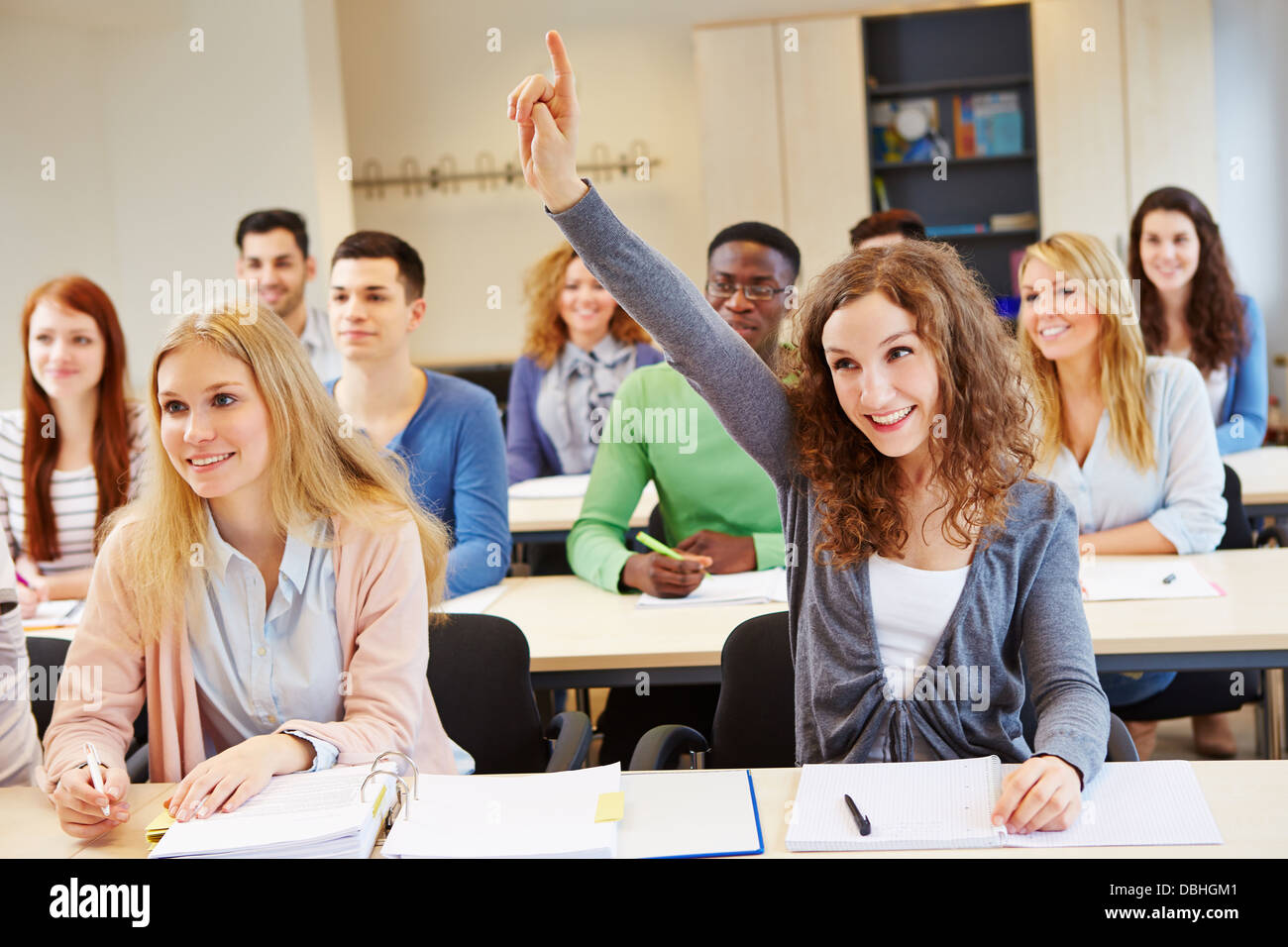 Woman raising finger question hi-res stock photography and images - Alamy