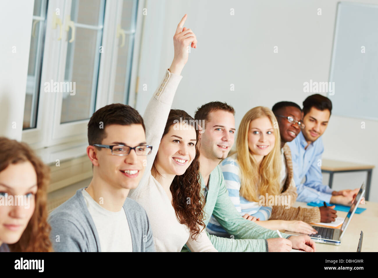 Woman raising finger question hi-res stock photography and images - Alamy
