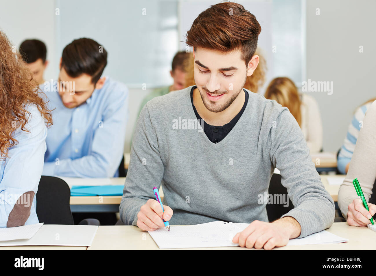 Young mann taking a screening test in assessment center Stock Photo - Alamy