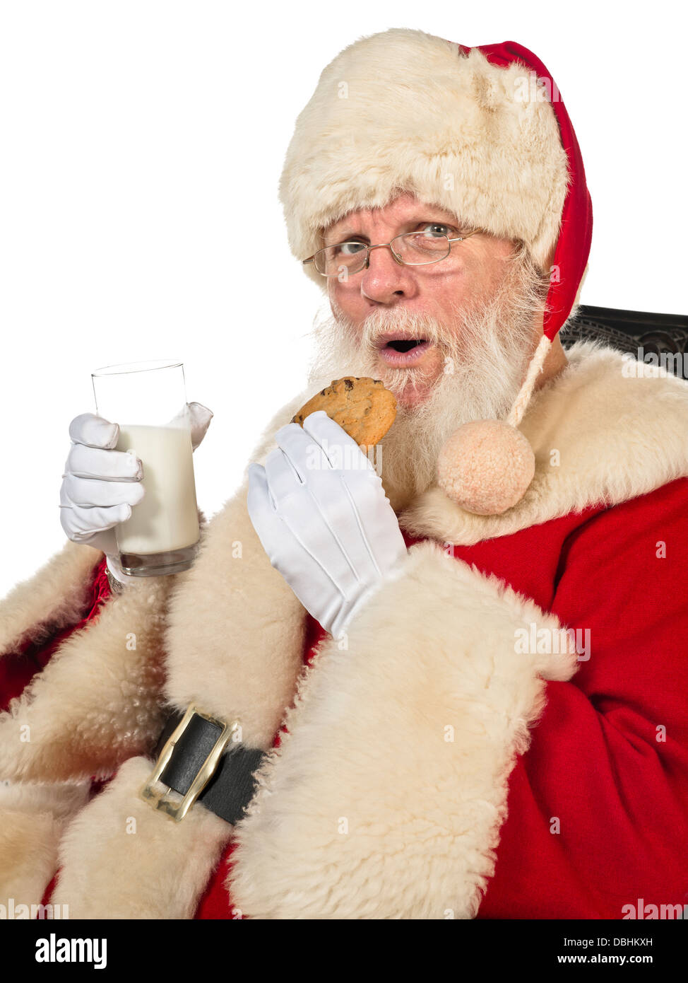 santa claus drinking milk and eating cookies Stock Photo - Alamy