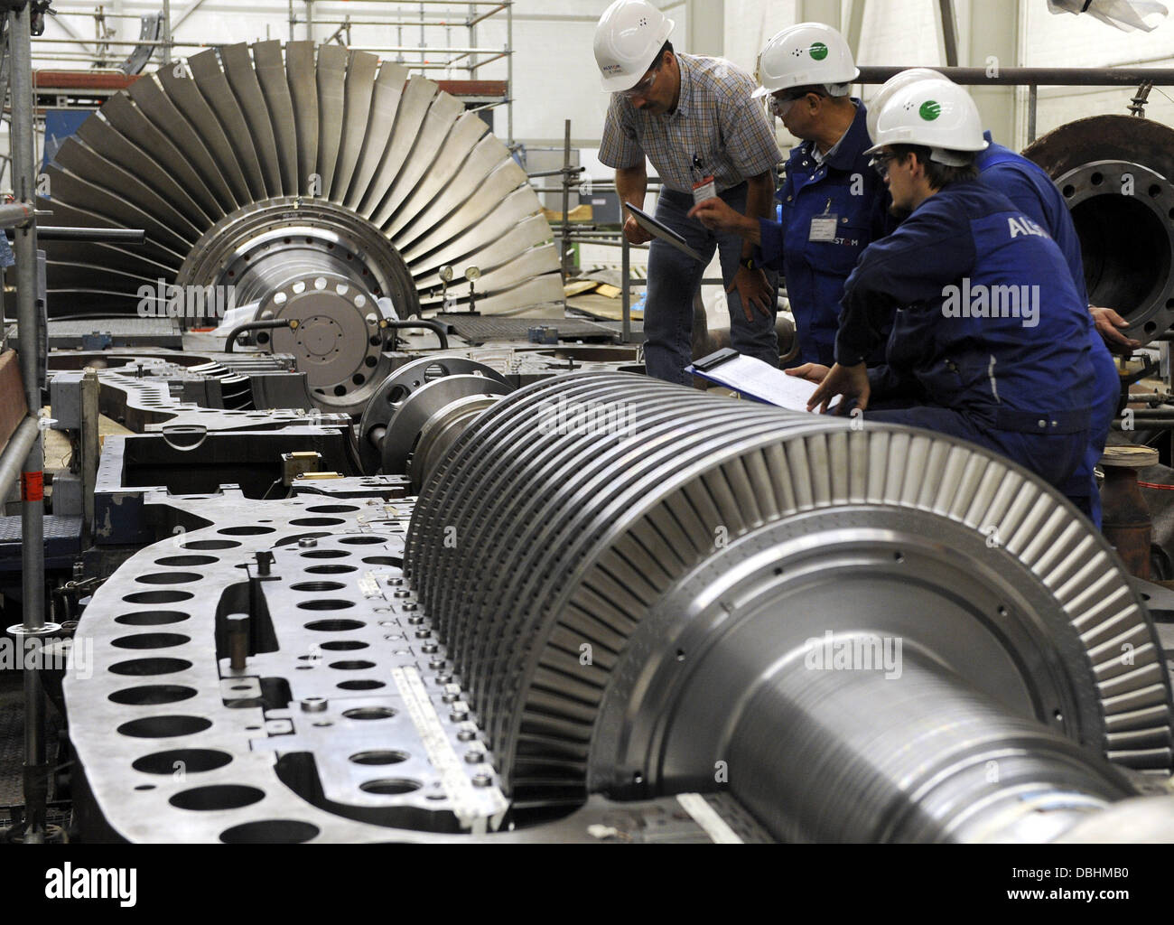 Technicians assemble a new steam turbine system in the hard Stock Photo ...