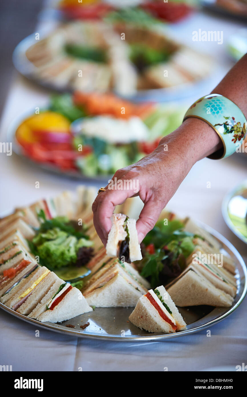 lady picking a sandwich Stock Photo - Alamy