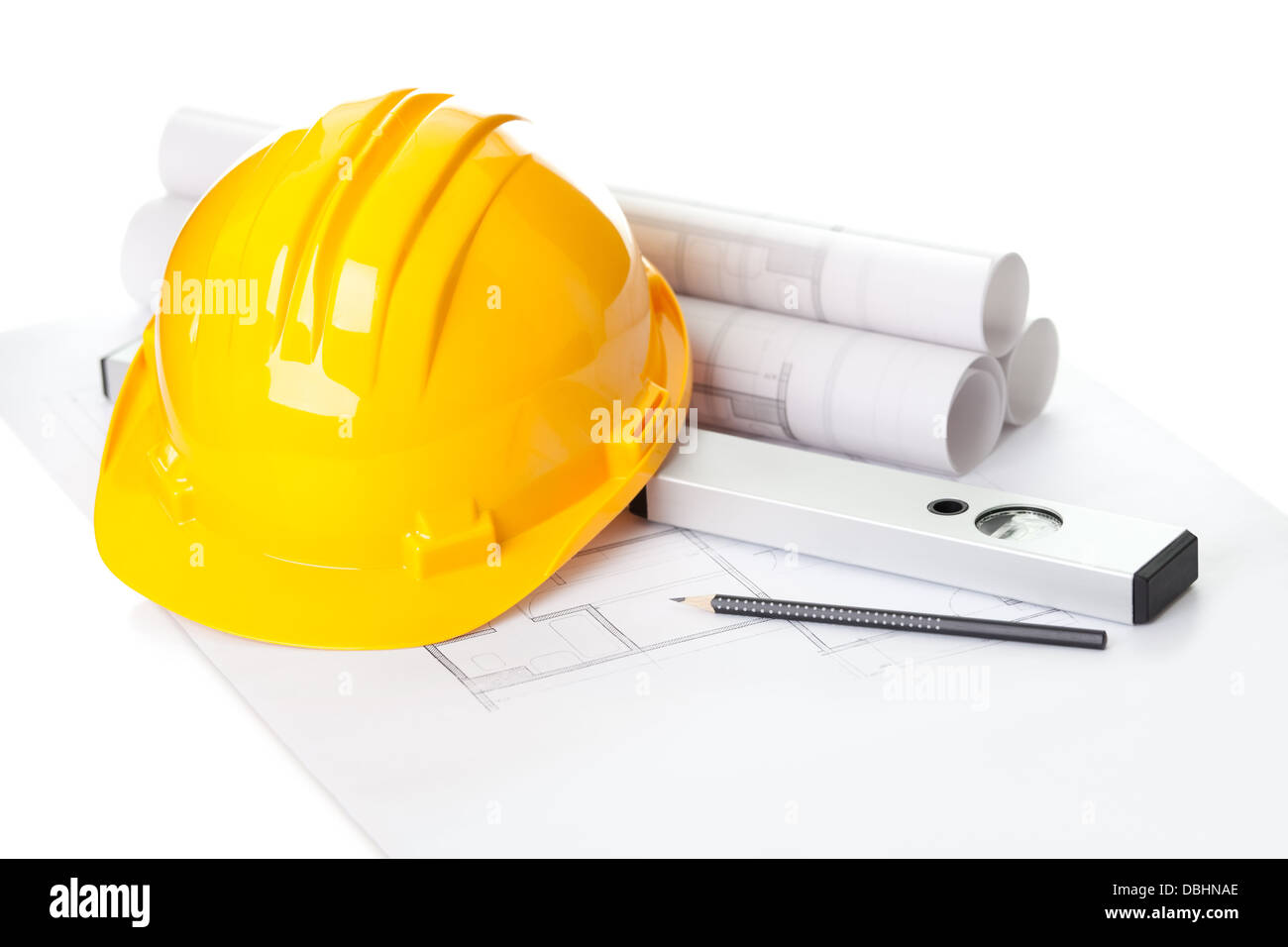 Yellow helmet on house project construction plan Stock Photo - Alamy