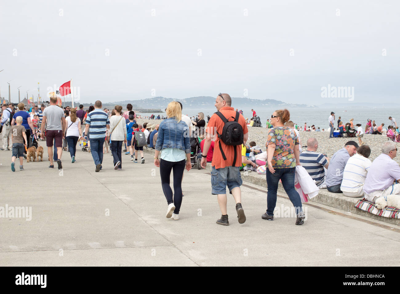People walking on a beach in Bray Stock Photo - Alamy