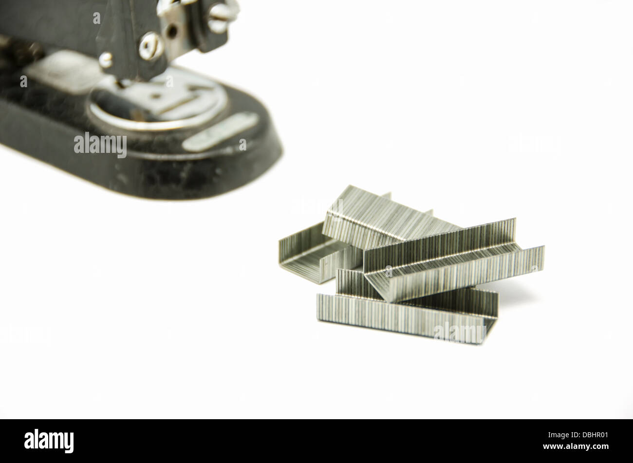 Staples and stapler on white background Stock Photo - Alamy