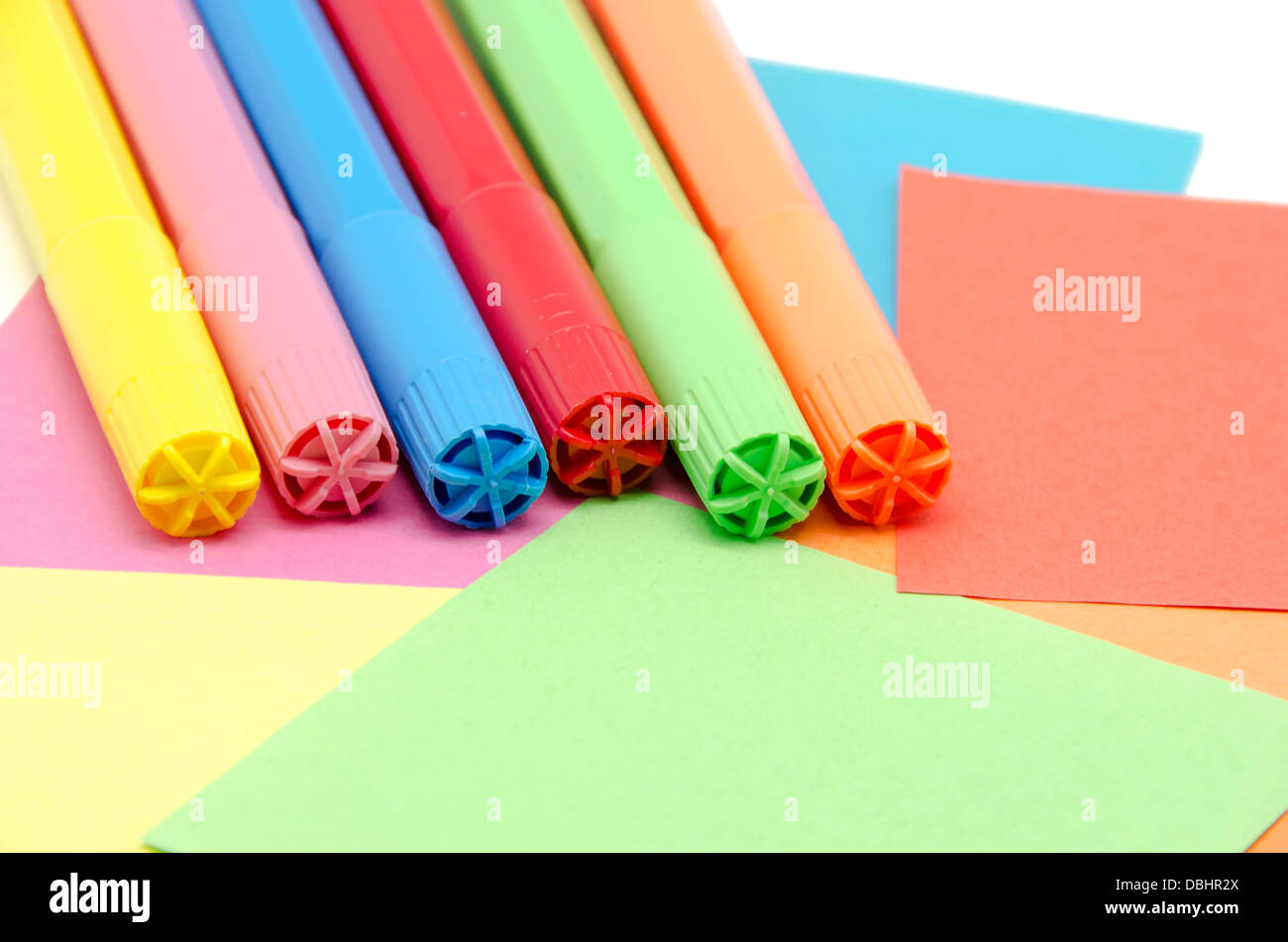 Pens on colored paper Stock Photo - Alamy
