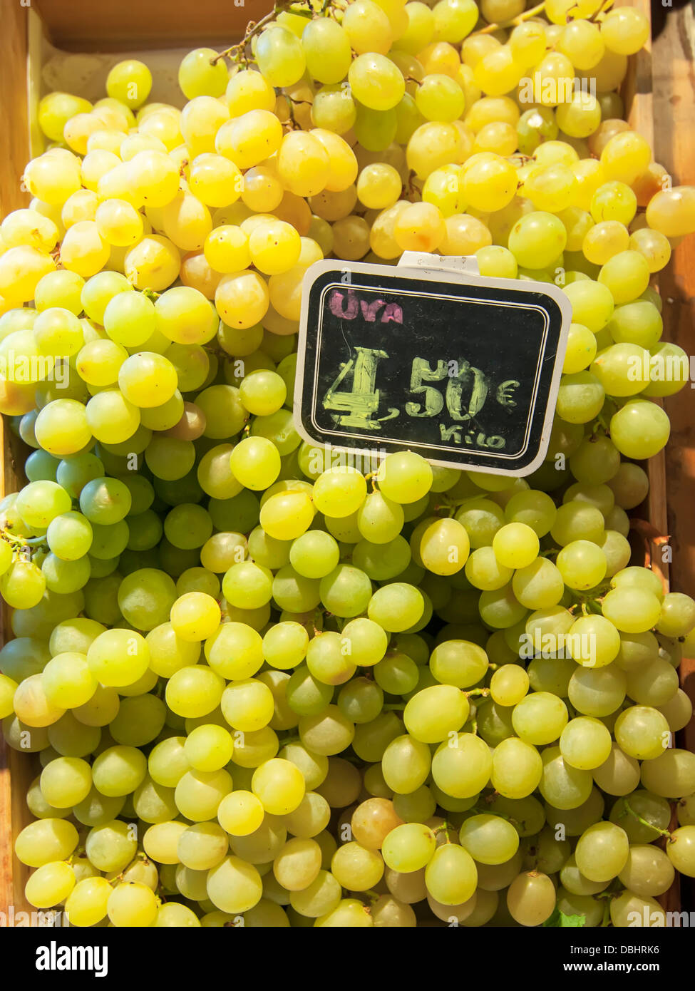 Bunches of grapes on the market with the price announcement Stock Photo ...