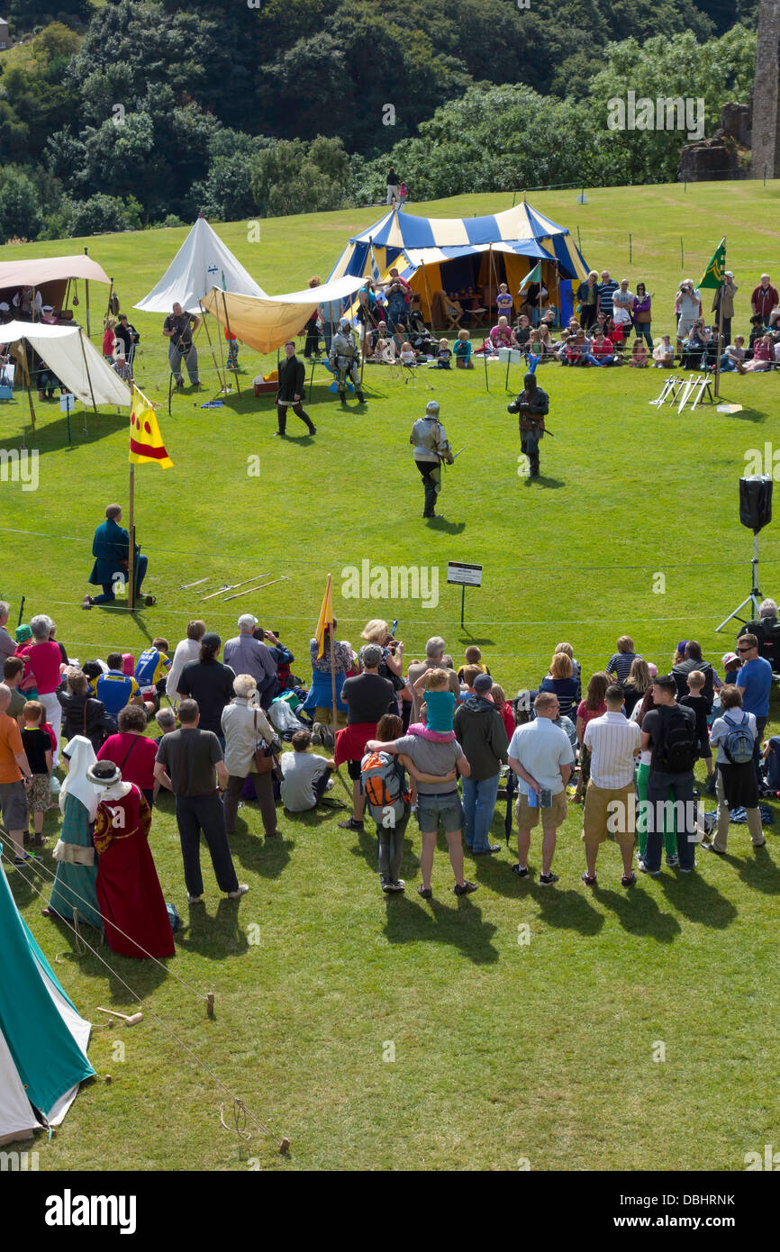 Crowd watching two knights in armour in an historical Medieval ...